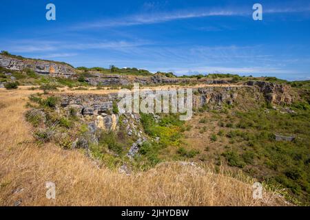 The disused Penmon Quarry on the Menai Strait, Isle of Anglesey, North ...