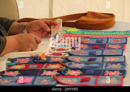Indigenous Dene woman sewing beaded handicrafts, Yellowknife, Northwest ...
