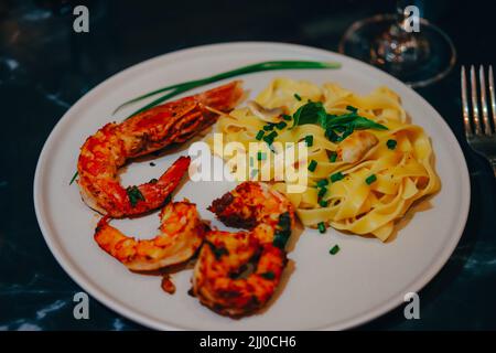 Pasta with shrimps and langustine. Seafood. Home cooking. Dining Stock ...