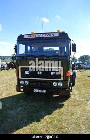 A 1982 ERF C40 lorry with low loader trailer parked on display at the ...