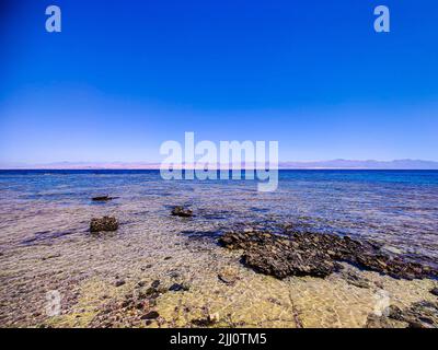 Seashore in Ras Shitan, Sinai, Egypt with Rocks and water Stock Photo ...