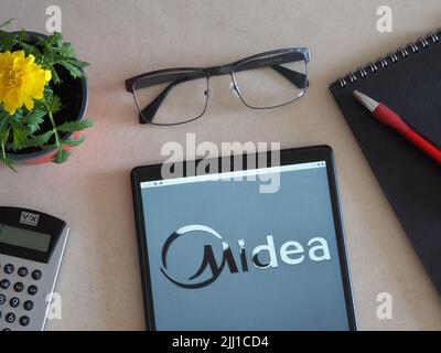 In this photo illustration, the logo of Midea Group is displayed on the ...