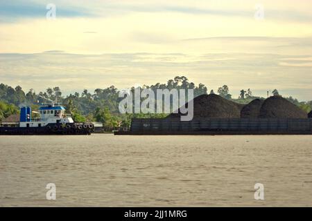 Coal barge on Segah River in Tanjung Redeb, Berau, East Kalimantan ...