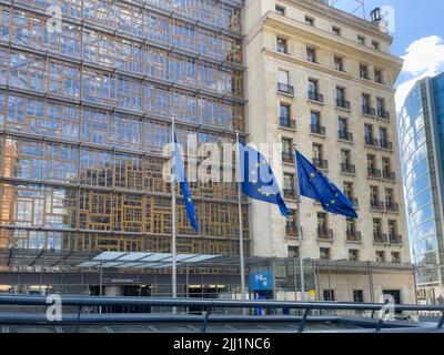 Car's window view over 3 EU flags hanging outside Stock Photo - Alamy