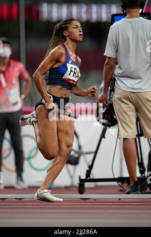 Floria Guei participating in the 4x400 meter relay at the 2020 Tokyo ...