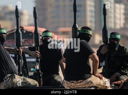 Armed men from the Izz al-Din al-Qassam Brigades, the military wing of ...