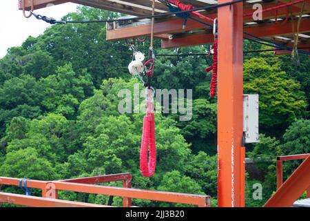 Bungie Jump cable hardware on platform above river Stock Photo - Alamy