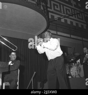 A portrait of the legendary jazz musician Louis Armstrong, taken at ...