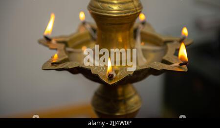 Brass Oil lamp illuminated before the opening ceremony close-up shot ...