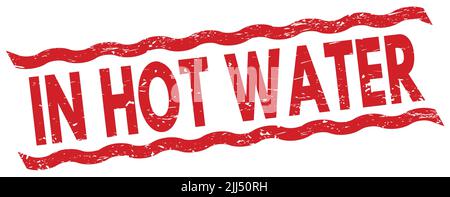 IN HOT WATER text written on green rectangle stamp sign Stock Photo - Alamy