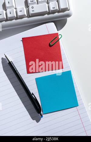 Sticky Note With Important Message Clipped On Opened Notebook On Desk ...