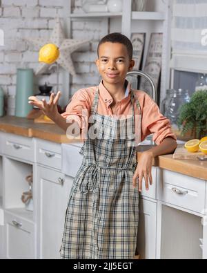 Happy afro family preparing dough together in kitchen Stock Photo - Alamy