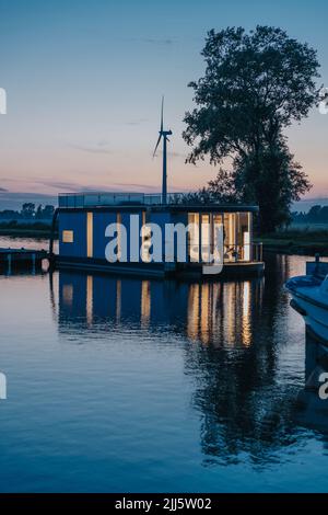 Natural reflections in the Yser river in Diksmuide, West Flanders ...