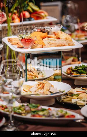 Festive holiday table with many dishes on Christmas or New Year ...