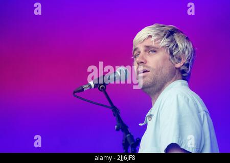 Keyboard player performing on stage live concert in front of people ...