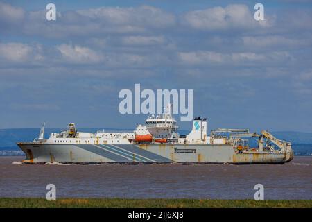 Cable layer Decisive heading out to sea Stock Photo - Alamy