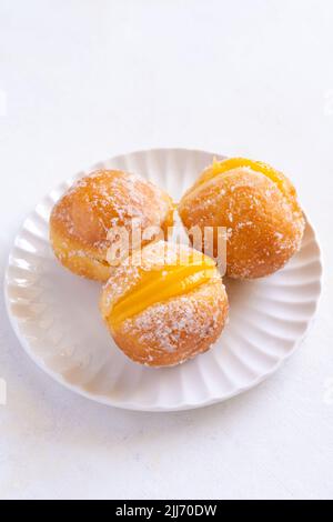 Berlin ball sweets on a plate on the table Stock Photo - Alamy
