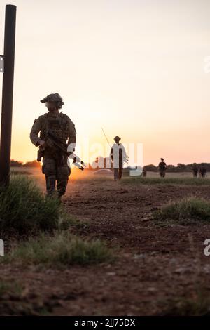 Marine critical skills operators conduct an after action debrief with ...