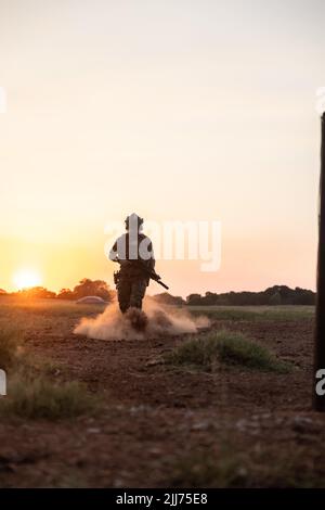 A critical skills operator patrols alongside explosive ordnance ...