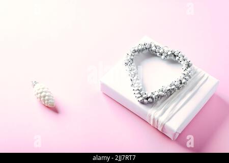 Christmas present on bright paper background. Close up. Copy space ...