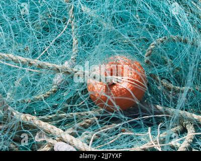 Blue fisher net to catch fish Stock Photo - Alamy