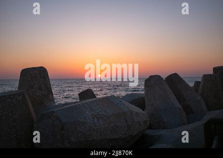 Coastal concrete fortification along a pier in the sea Stock Photo - Alamy