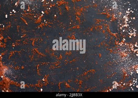 dark background flecks salt red pepper food spices Stock Photo - Alamy