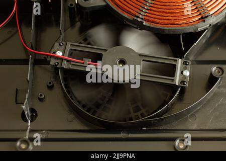 Rotating induction cooker fan, cooling the electronic and heating ...