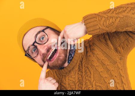 White ginger man with beard showing silence gesture at camera isolated ...