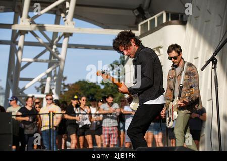Sam Roberts plays guitar and sings on stage with bassist James Hall and ...