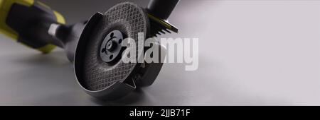 Angle pneumatic grinders grinder with disc on gray. Modern rechargeable ...