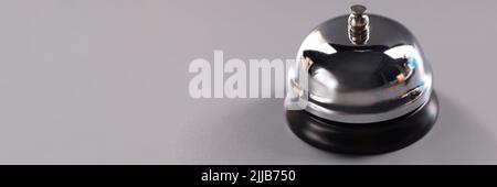 Silver vintage ringing bell on gray background. Ringing bell at the ...