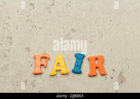 Plastic colorful letters with the text: Fair close up Stock Photo - Alamy