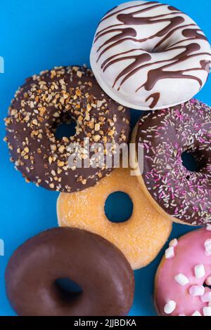 Donuts glazed with various sprinkles Stock Photo - Alamy