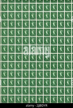 A sheet of vintage green postage stamps from around the world on a ...