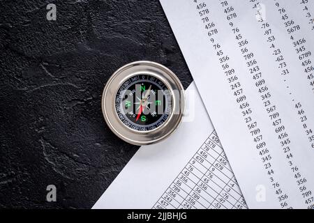 Reinvent and recover business. Compass with business calculations Stock ...