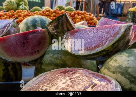 Sale of watermelons exposed in the street. Refreshing summer fruit ...