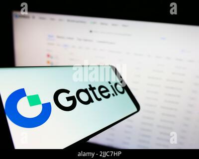 Gate.io is a cryptocurrency exchange. Gate.io logo on smartphone screen ...