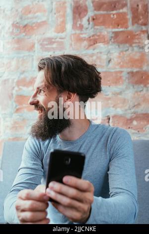 idle leisure addiction man phone kitchen breakfast Stock Photo - Alamy