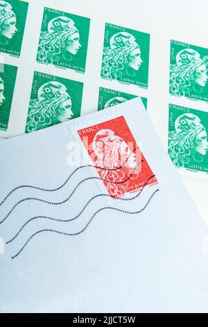 Collection of French stamps on an envelope showcasing postal service in ...