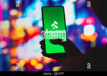 In this photo illustration, the Associated Bank logo is displayed on a ...