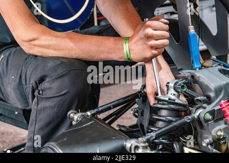 The famous black and gold JPS Lotus Formula 1 cars n the pits of the ...