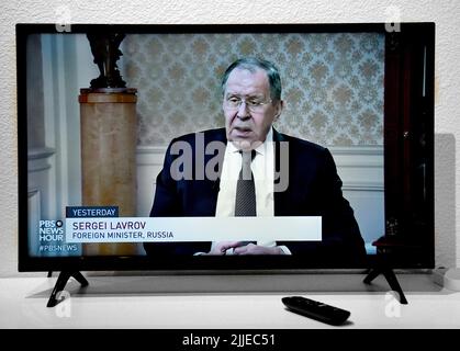 A television screenshot taken during a PBS NewsHour interview with ...