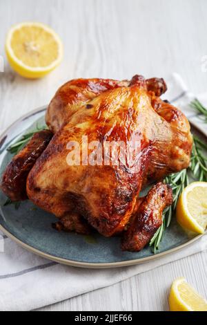 Homemade Lemon and Herb Rotisserie Chicken on a Plate, top view. Flat ...
