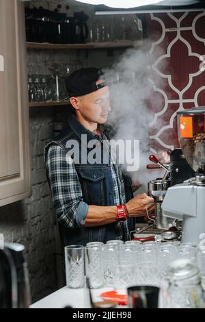 Handsome barista in hat Stock Photo - Alamy