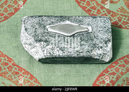 Production of medieval coins by casting and forging. Reconstruction of ...