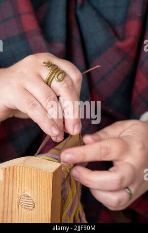 An ancient Roman woman makes yarn and sews from vintage wool ...