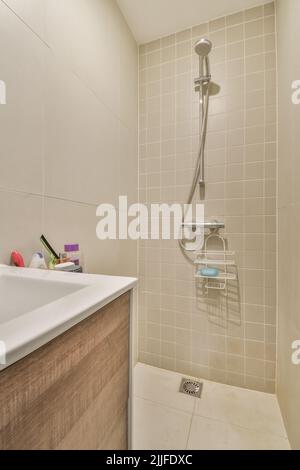 Sinks with mirrors and clean bathtub located near shower box with glass ...