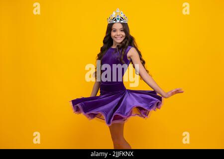 Movement windy dress. Little queen wearing golden crown. Teenage girl ...