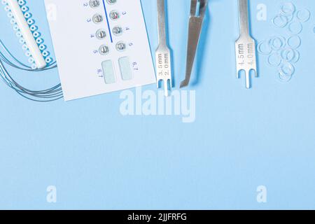 a set of special tools for an orthodontist to install braces for a ...
